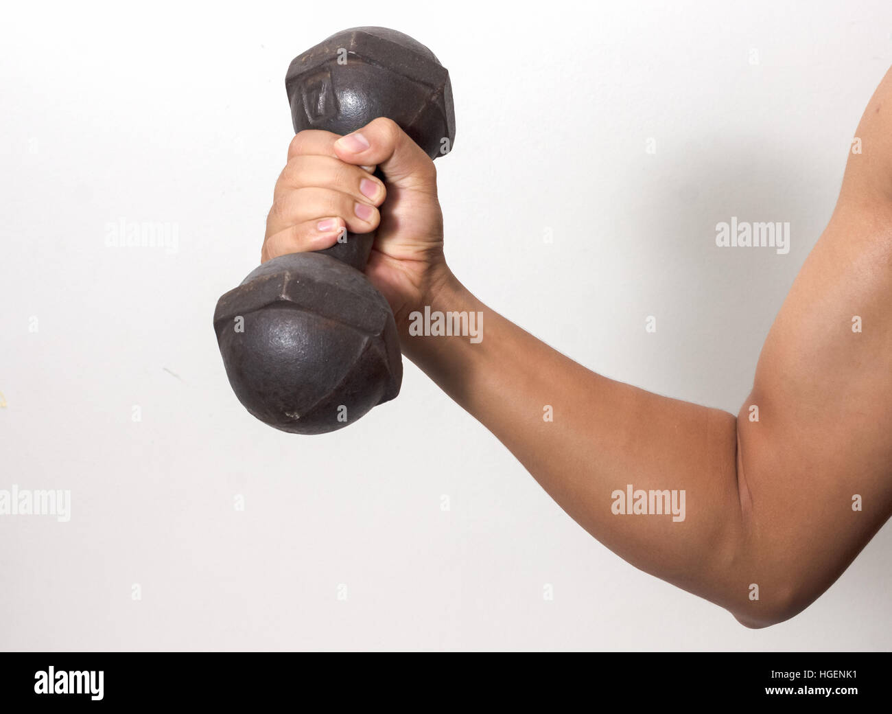 Hand holding dumbell on isolated white background Stock Photo - Alamy