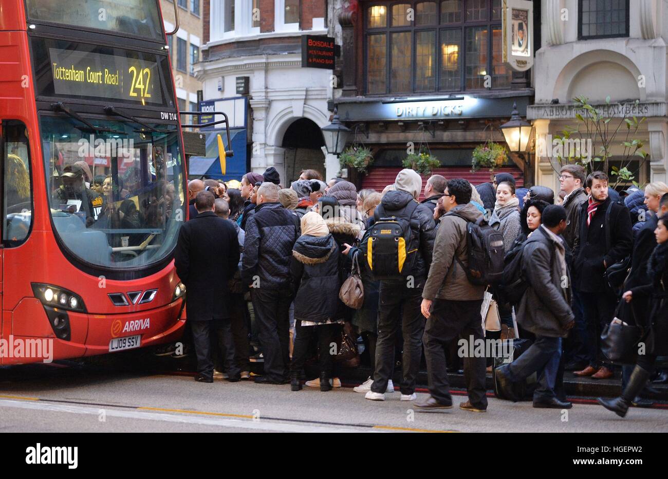 People queue for buses at Liverpool Street station, London, as London ...