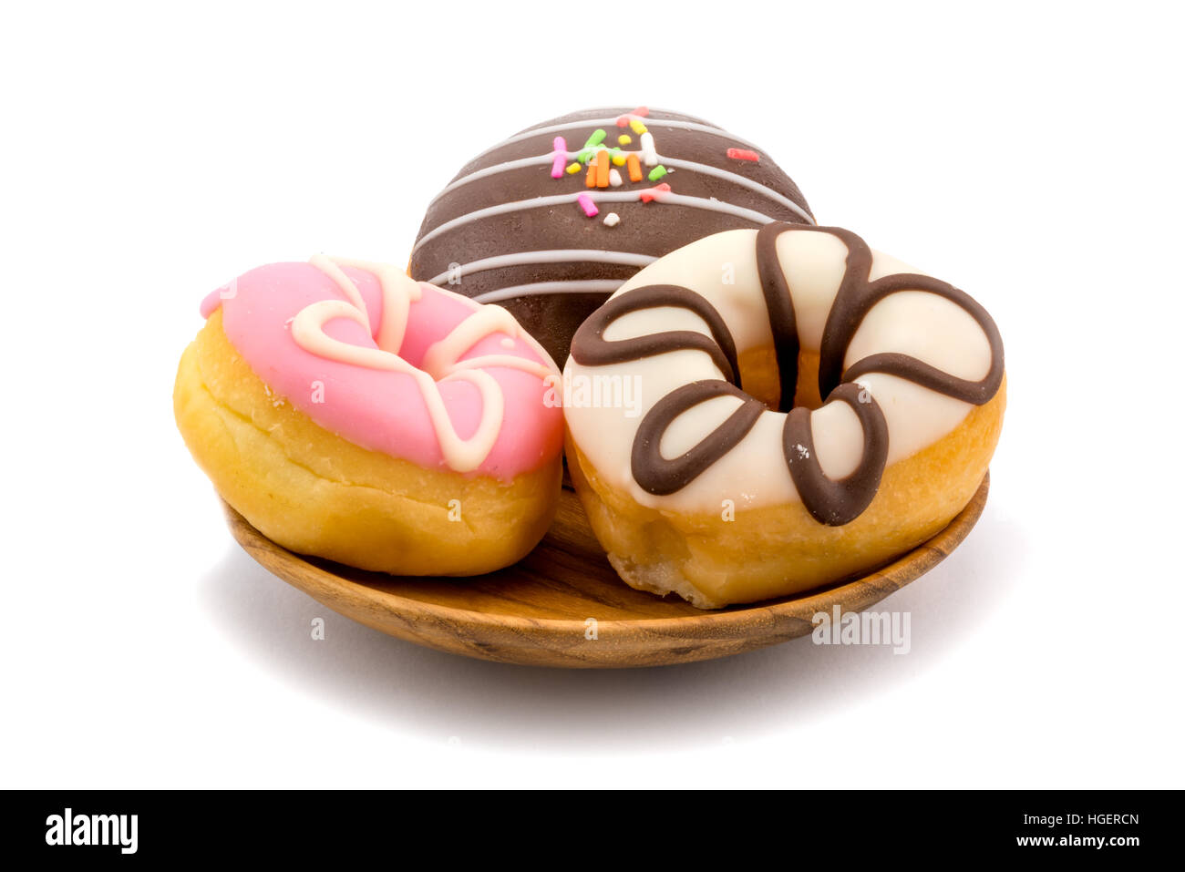 Tasty doughnuts in wooden plate on white background Stock Photo - Alamy