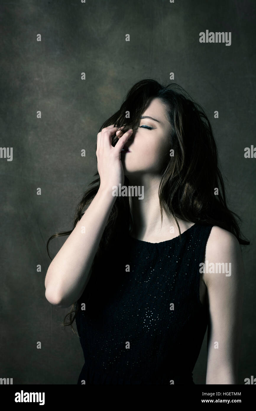 Frustrated young woman hand on face Stock Photo - Alamy