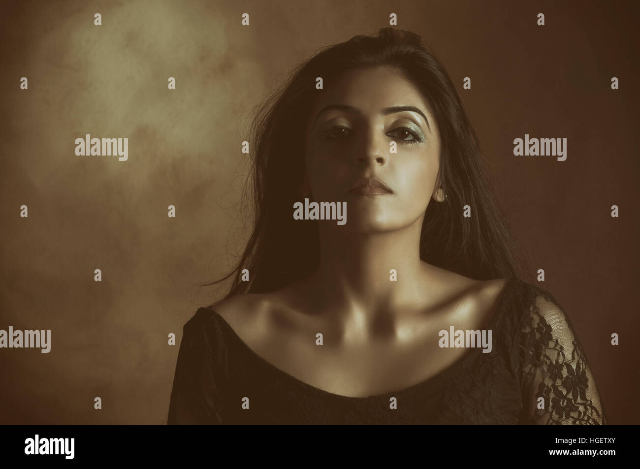 Serious Asian woman staring Stock Photo - Alamy