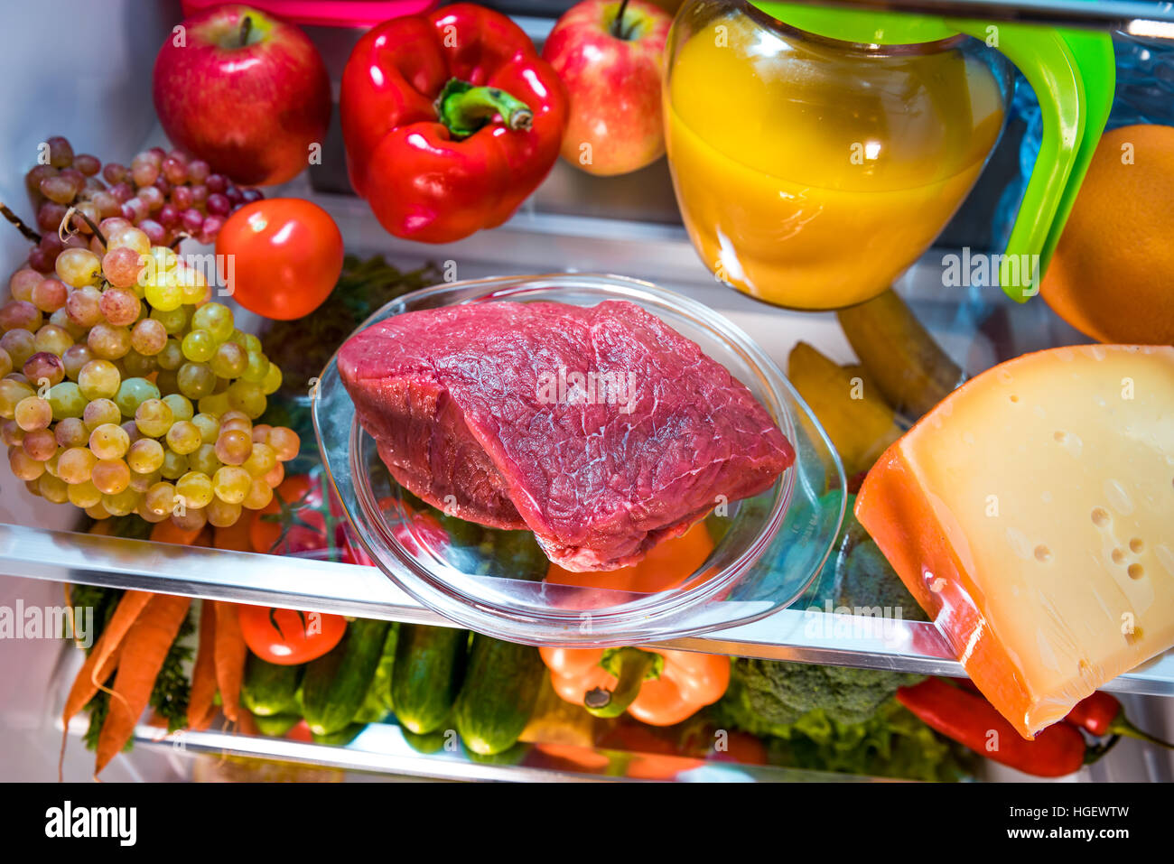 Fresh raw meat on a shelf open refrigerator Stock Photo - Alamy