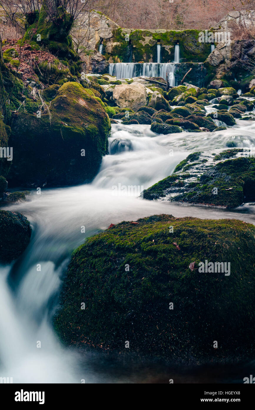 Long exposure - milky stream with cascade in the background Stock Photo ...