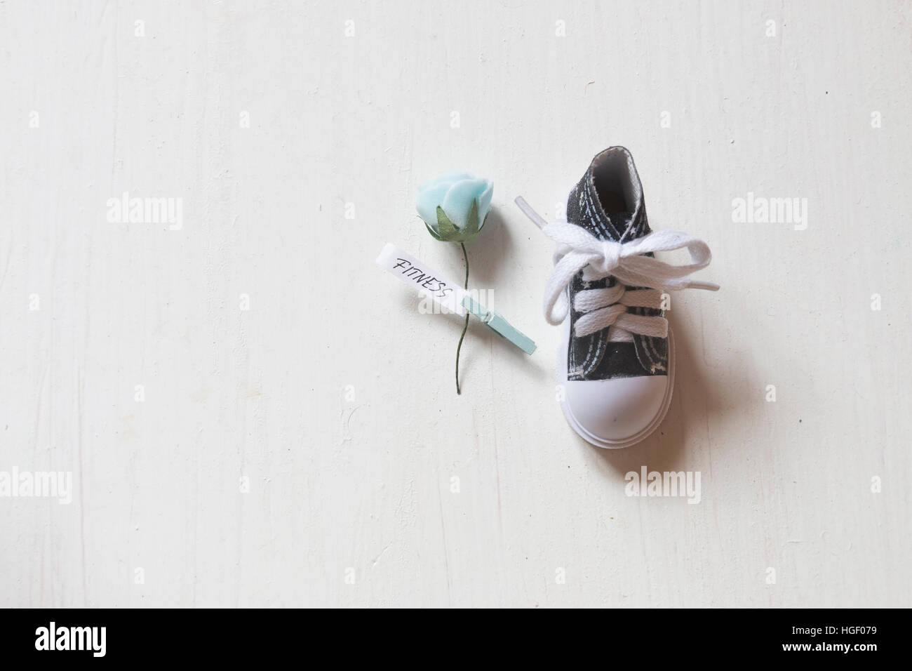 Fitness idea, flower with text and sport sneaker Stock Photo - Alamy