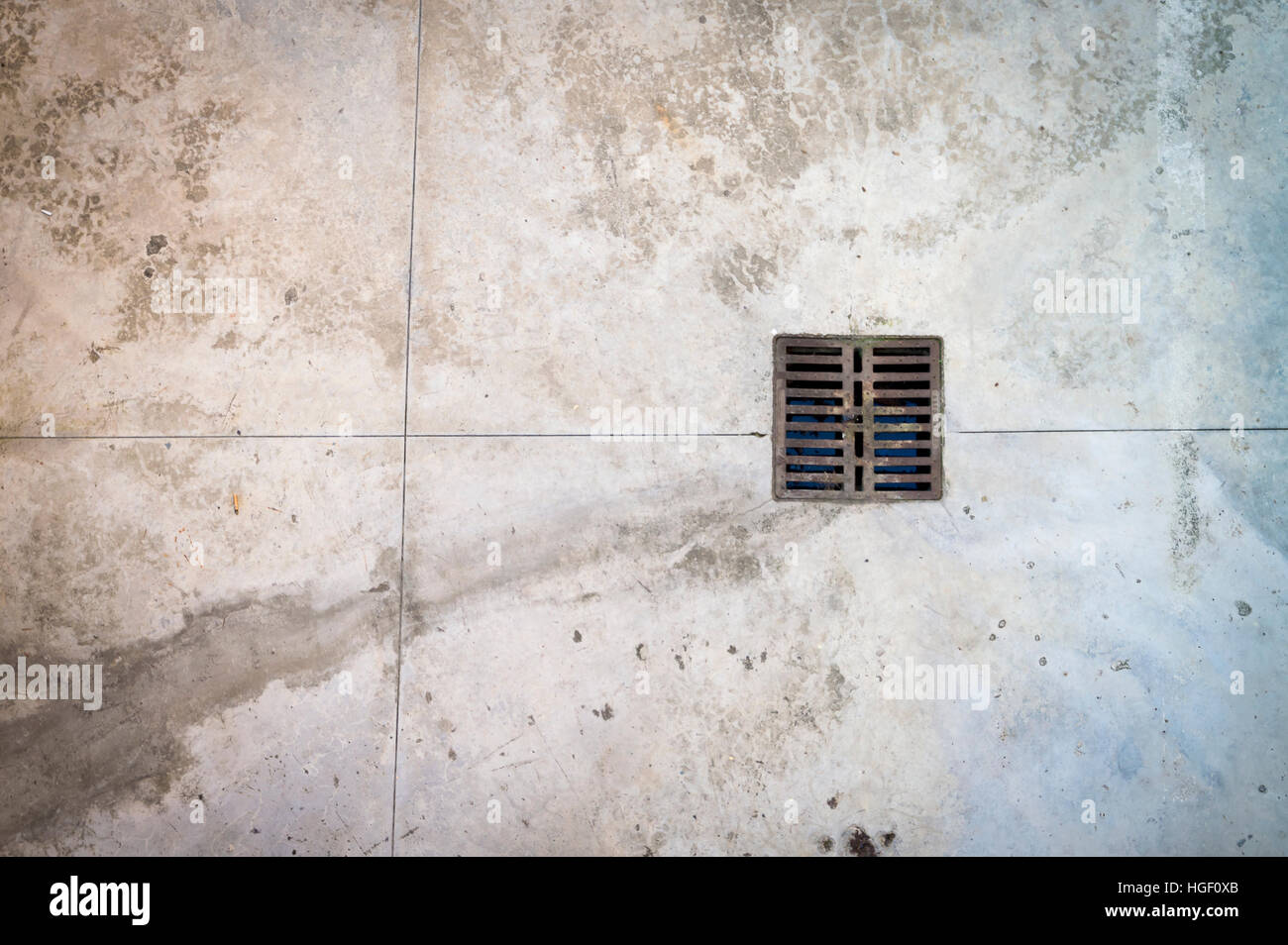 Square shape man hole cover urban background Stock Photo - Alamy