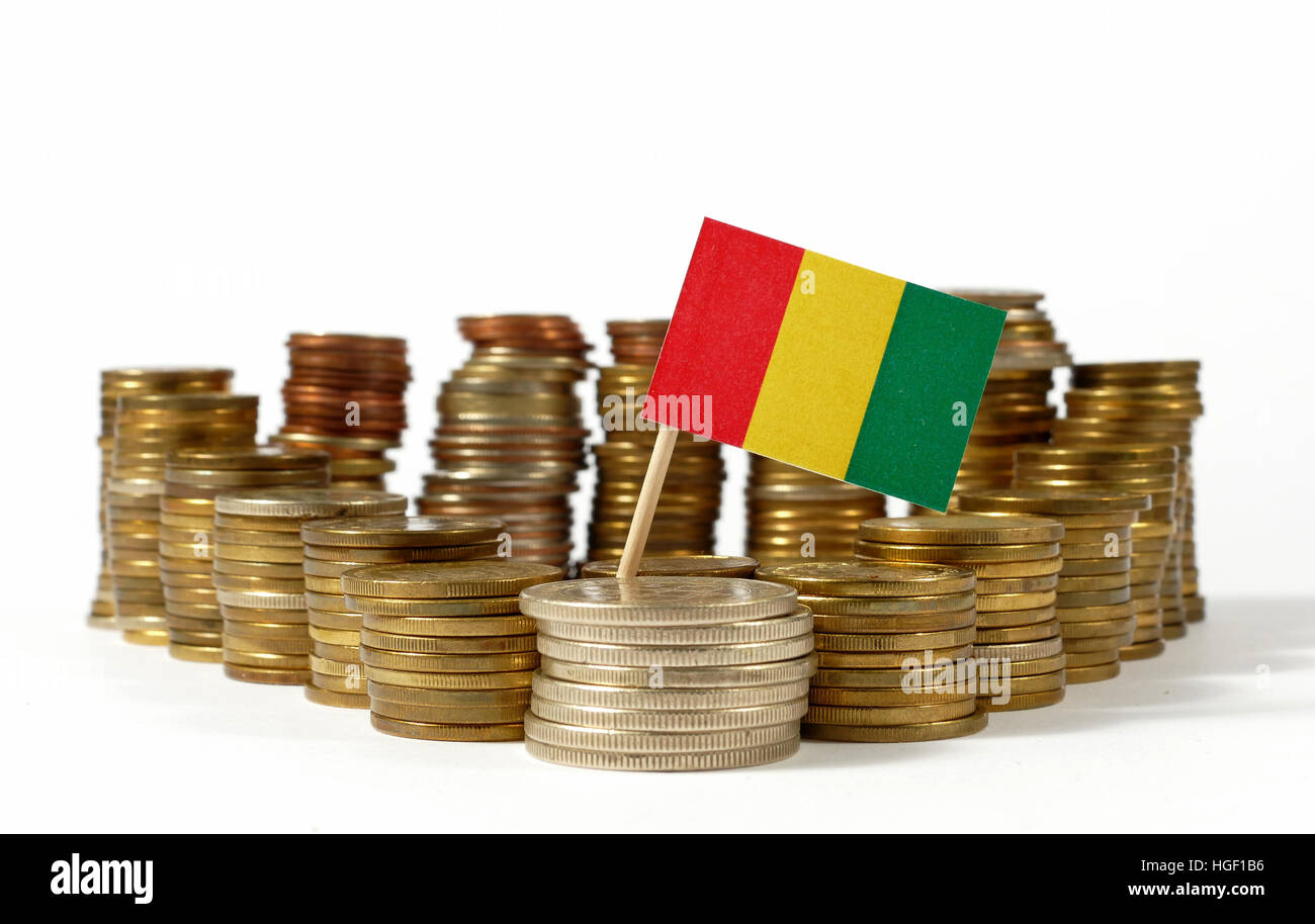 Guinea flag waving with stack of money coins Stock Photo - Alamy