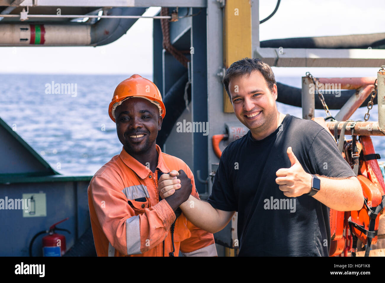 friendship of nations on board of ship/vessel. African seaman and ...