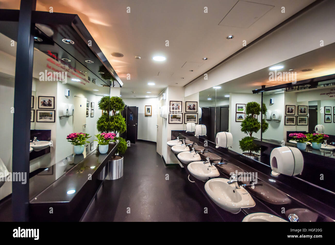 Wash basins in the gent's toilet at Royal Ascot Racecourse, Berks, UK ...
