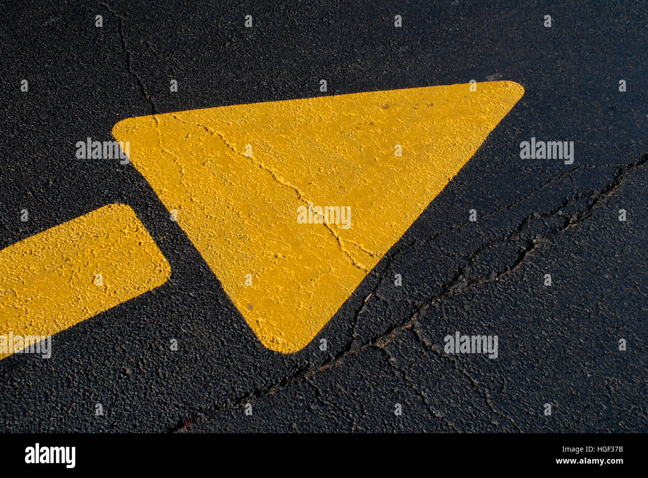 arrow painted on pavement Stock Photo - Alamy