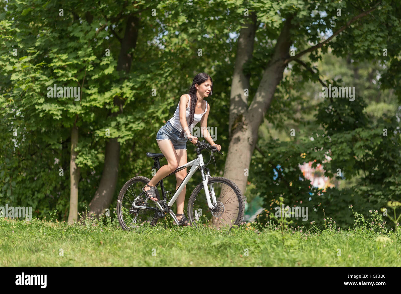 One woman cycling summer side view hi-res stock photography and images ...