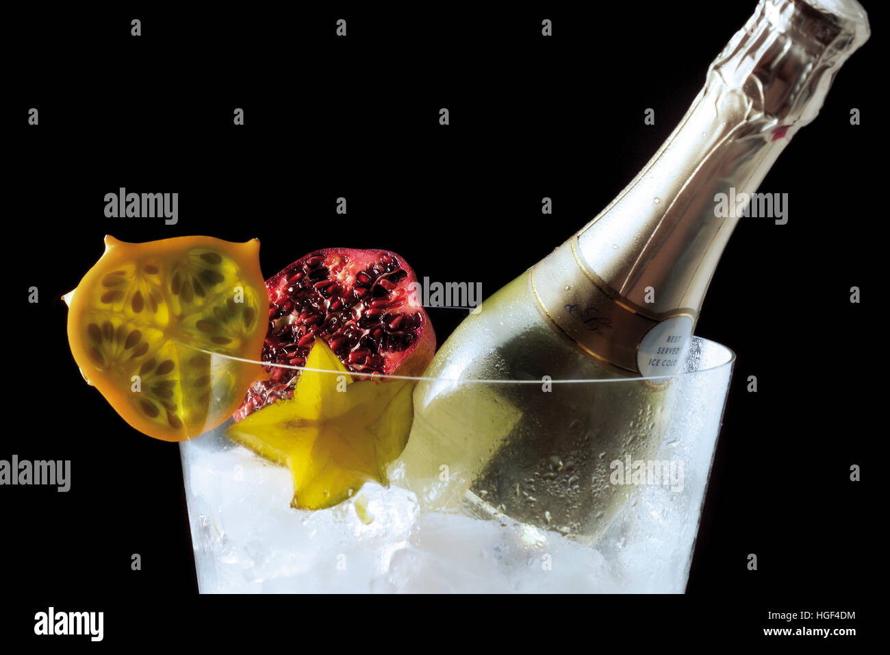 Bottle of champagne and fruit in a champagne cooler Stock Photo - Alamy