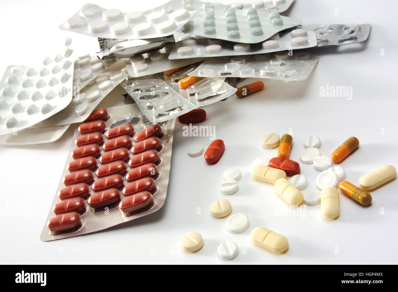 Pill packets and loose pills Stock Photo - Alamy