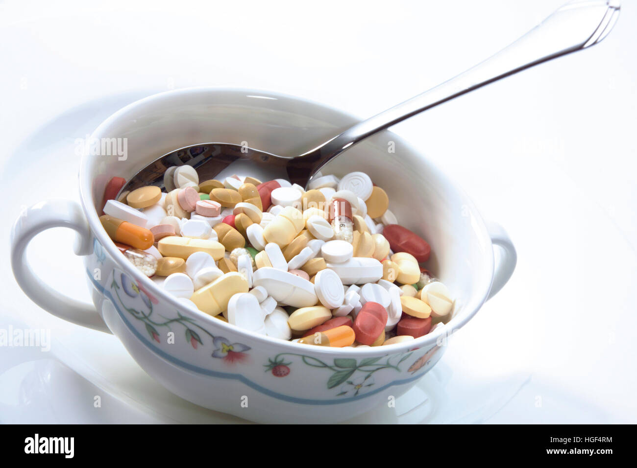 A soup bowl full of pills: symbol for dieting obsession Stock Photo - Alamy