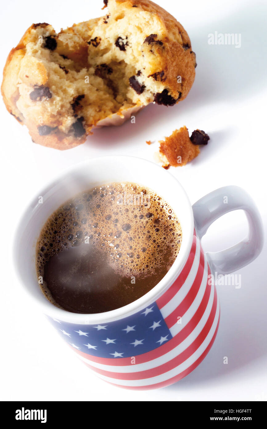Coffee mug with US flag design, muffin in background Stock Photo - Alamy