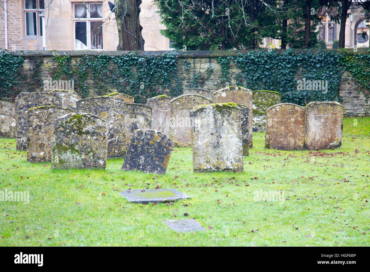 Lower Slaughter village in the English Cotswolds with old cemetery ...