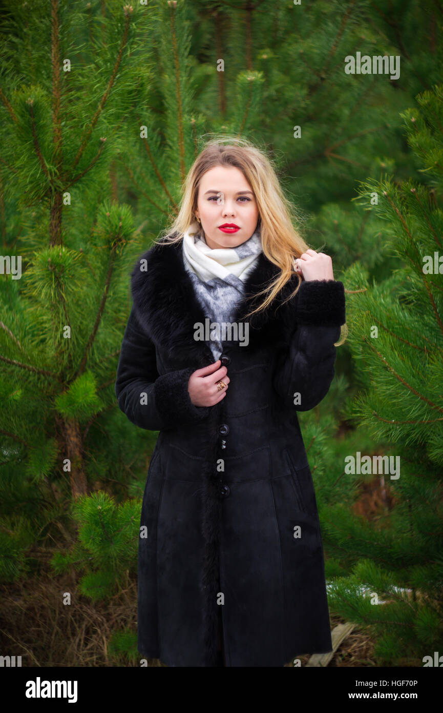 Woman posing in pines Stock Photo - Alamy
