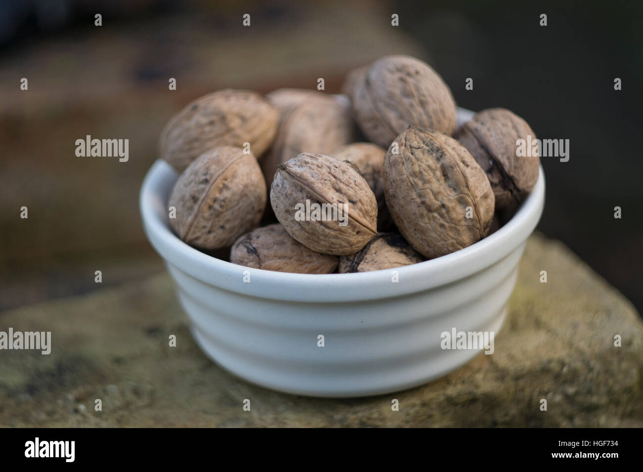 walnut in a small white bowl Stock Photo - Alamy