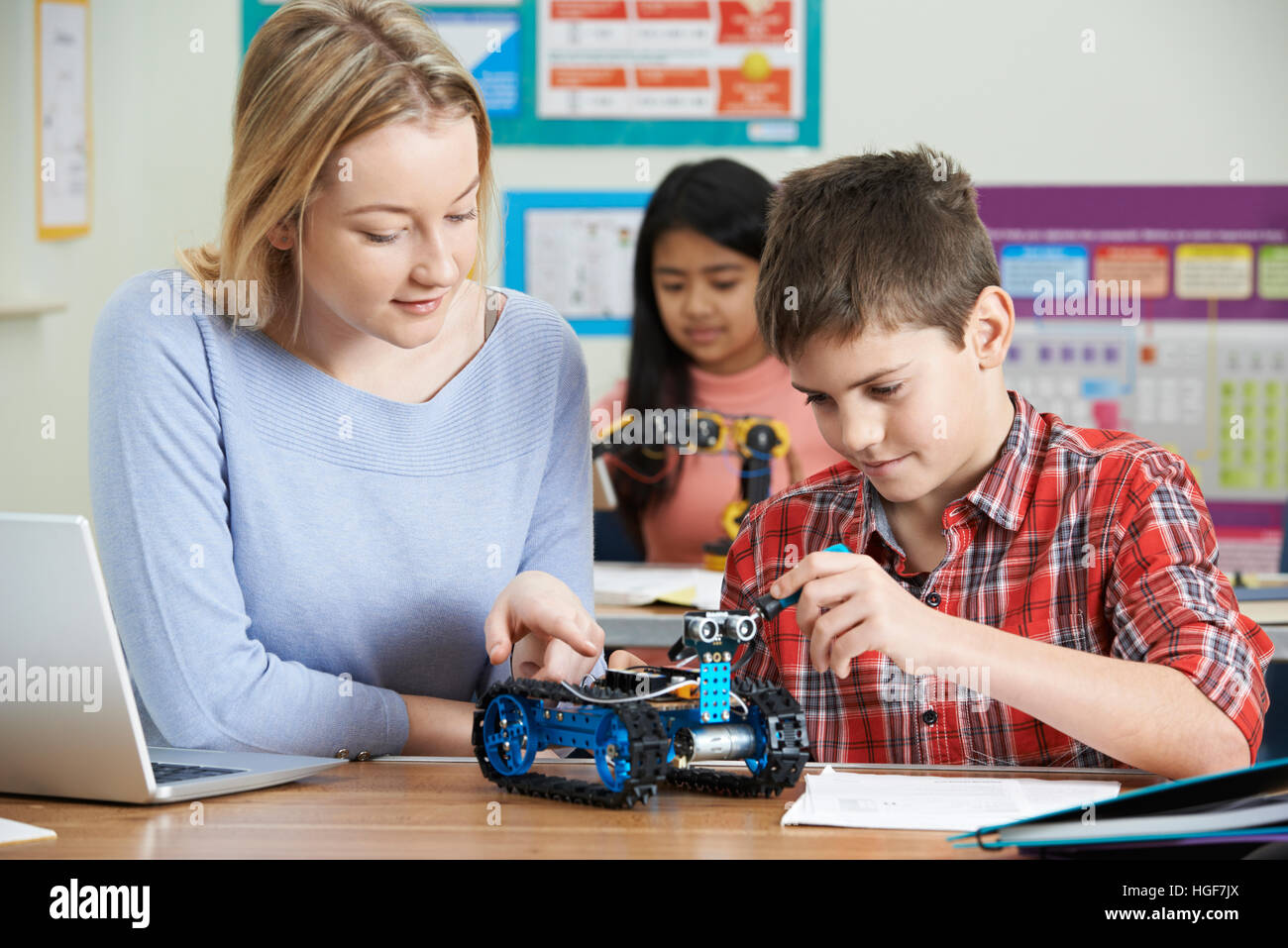 Teacher With Pupils In Science Lesson Studying Robotics Stock Photo - Alamy