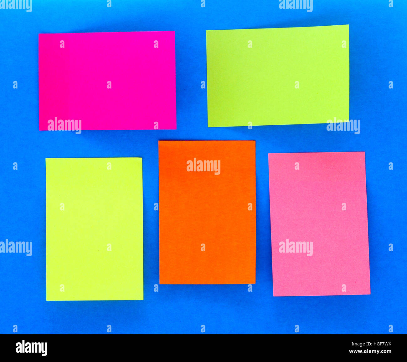 an empty color sticky notes on blue Stock Photo - Alamy