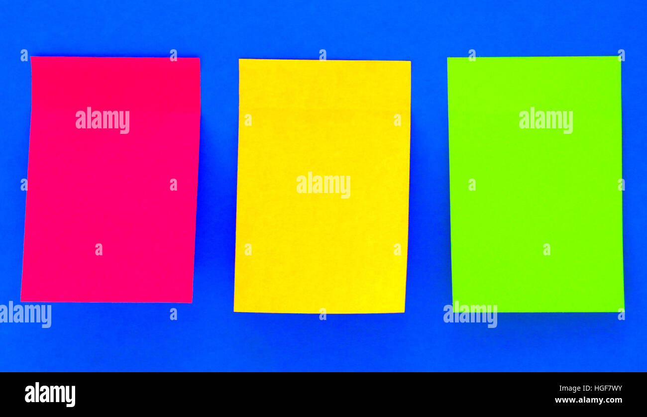 an empty color sticky notes on blue Stock Photo - Alamy