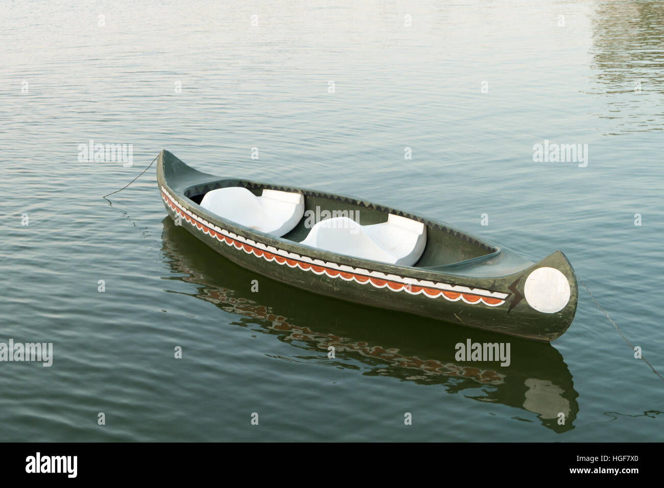 old canoes float on lake,Thailand Stock Photo - Alamy