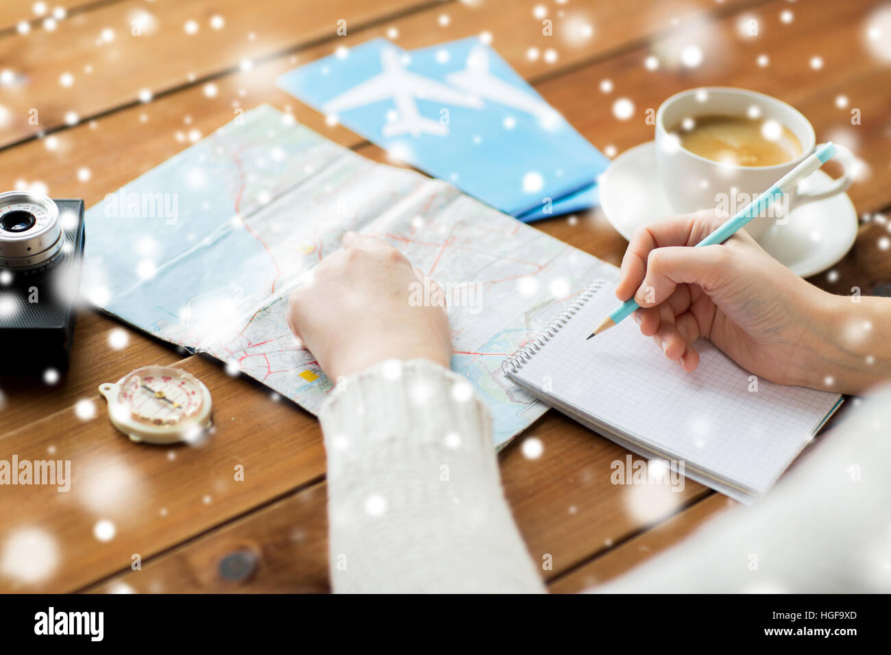 hands with map and coffee writing to notebook Stock Photo - Alamy