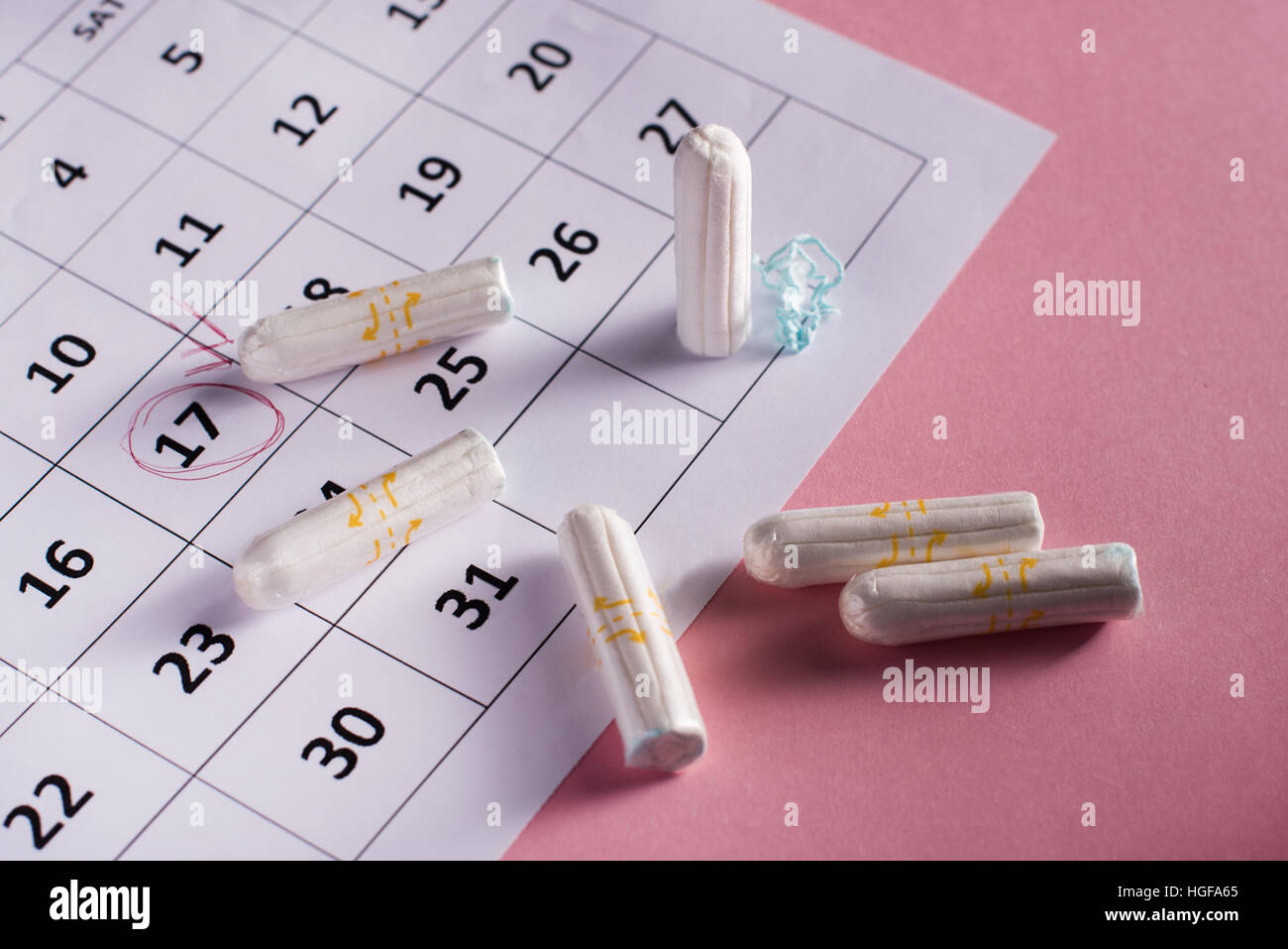 Clean white tampons on pink background Stock Photo - Alamy