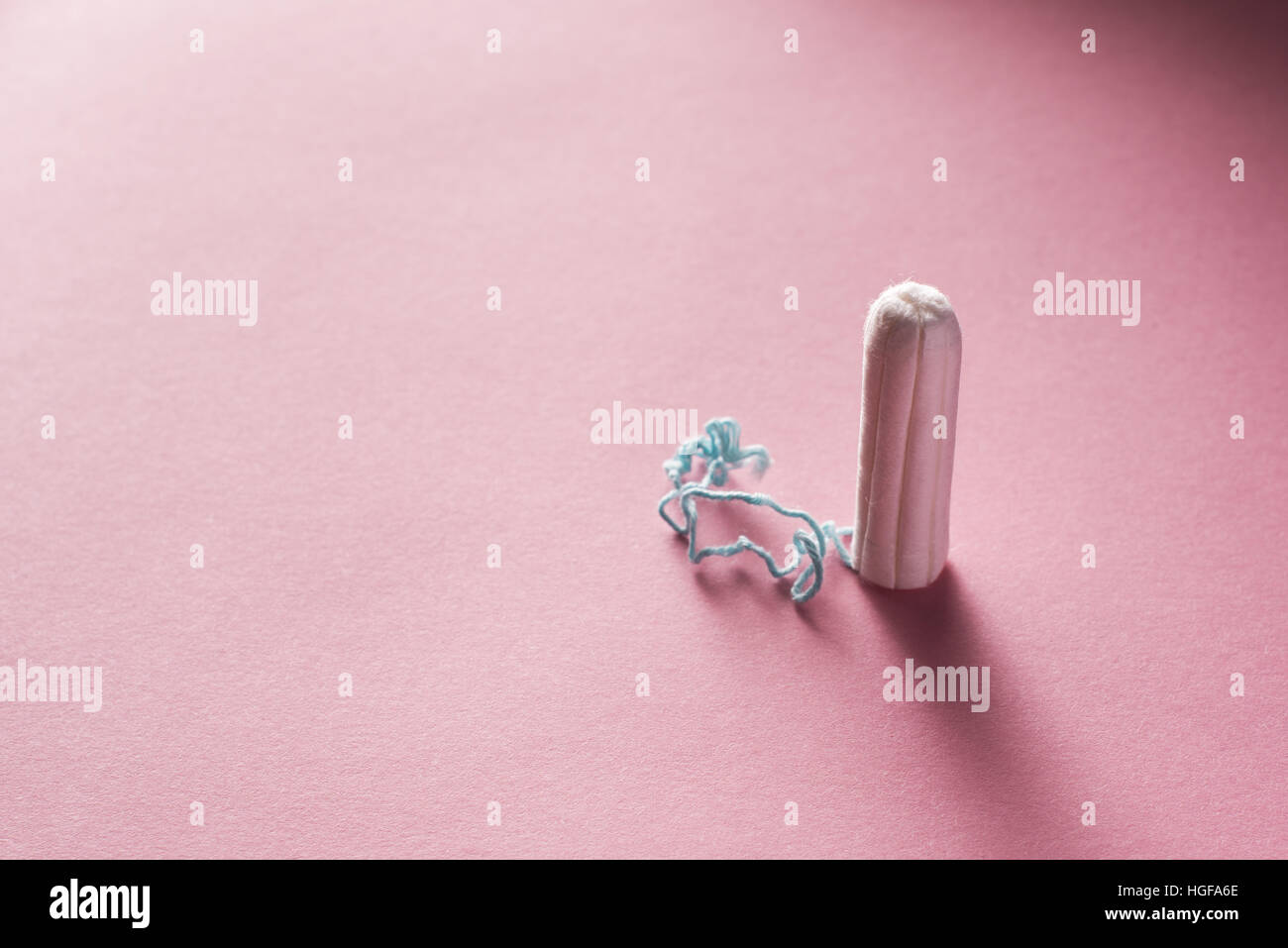 Clean white tampons on pink background Stock Photo - Alamy