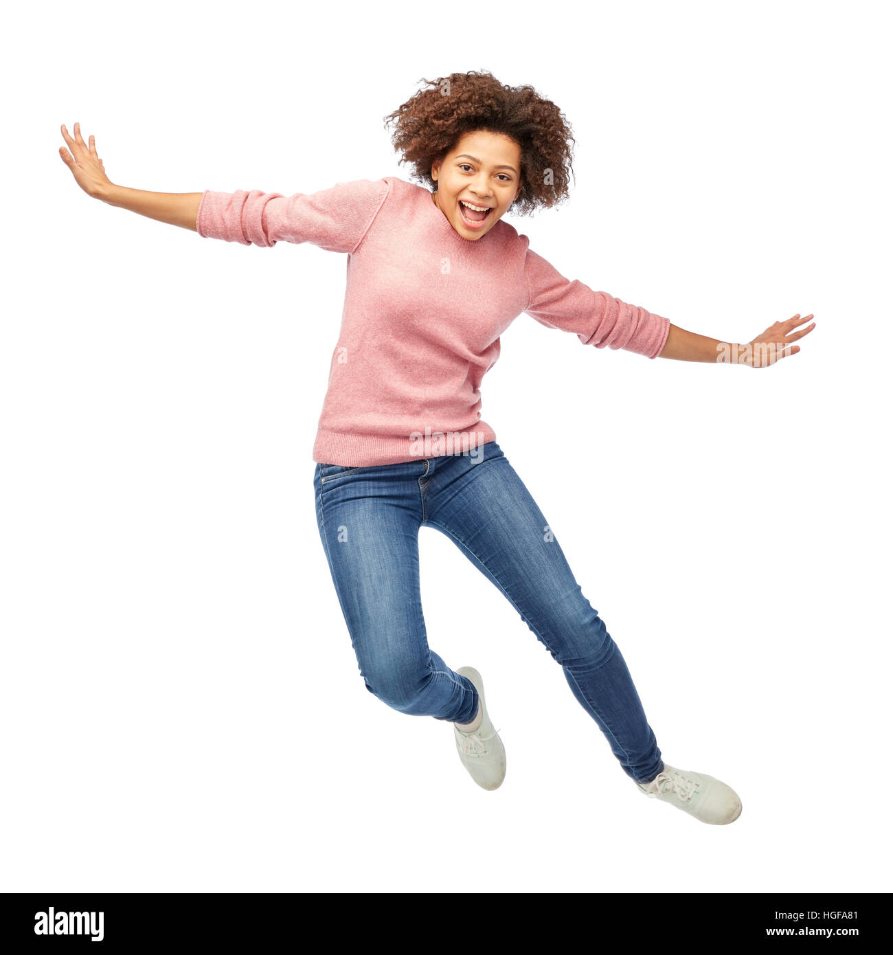 happy african american woman jumping over white Stock Photo - Alamy