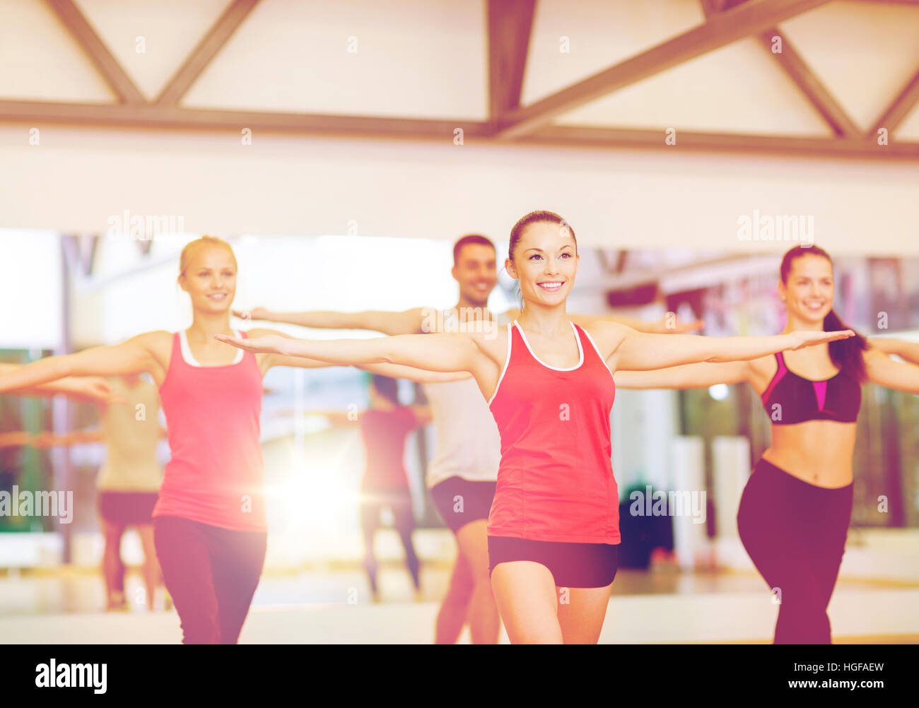group of smiling people exercising in the gym Stock Photo - Alamy