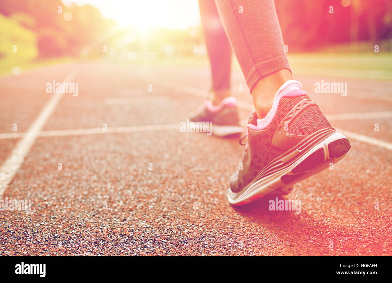 close up of woman feet running on track from back Stock Photo - Alamy