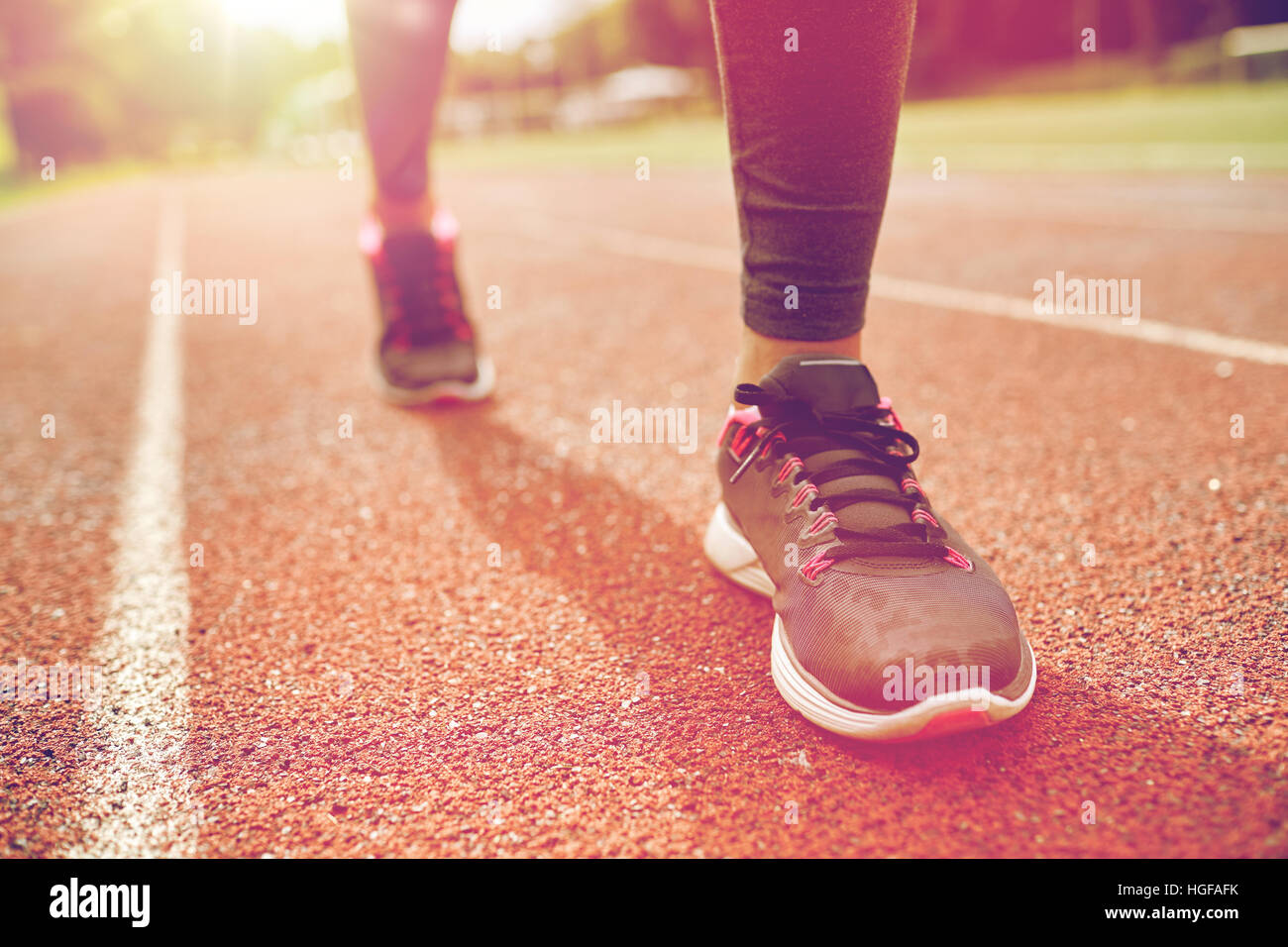 close up of woman feet running on track from back Stock Photo - Alamy