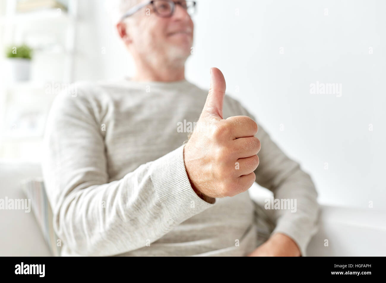 senior man showing thumbs up Stock Photo - Alamy