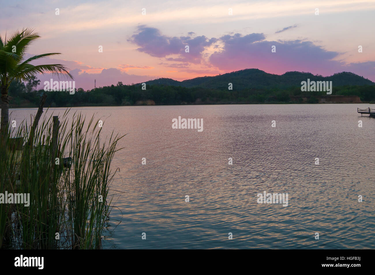 Colorfull sky after sunset over the lake in Thailand Stock Photo - Alamy
