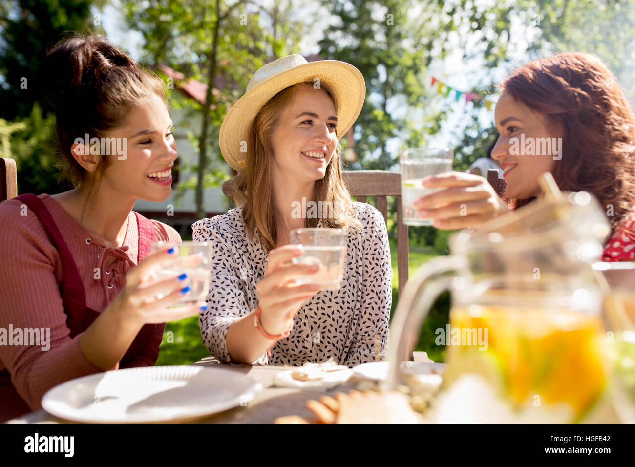 happy friends having party at summer garden Stock Photo - Alamy