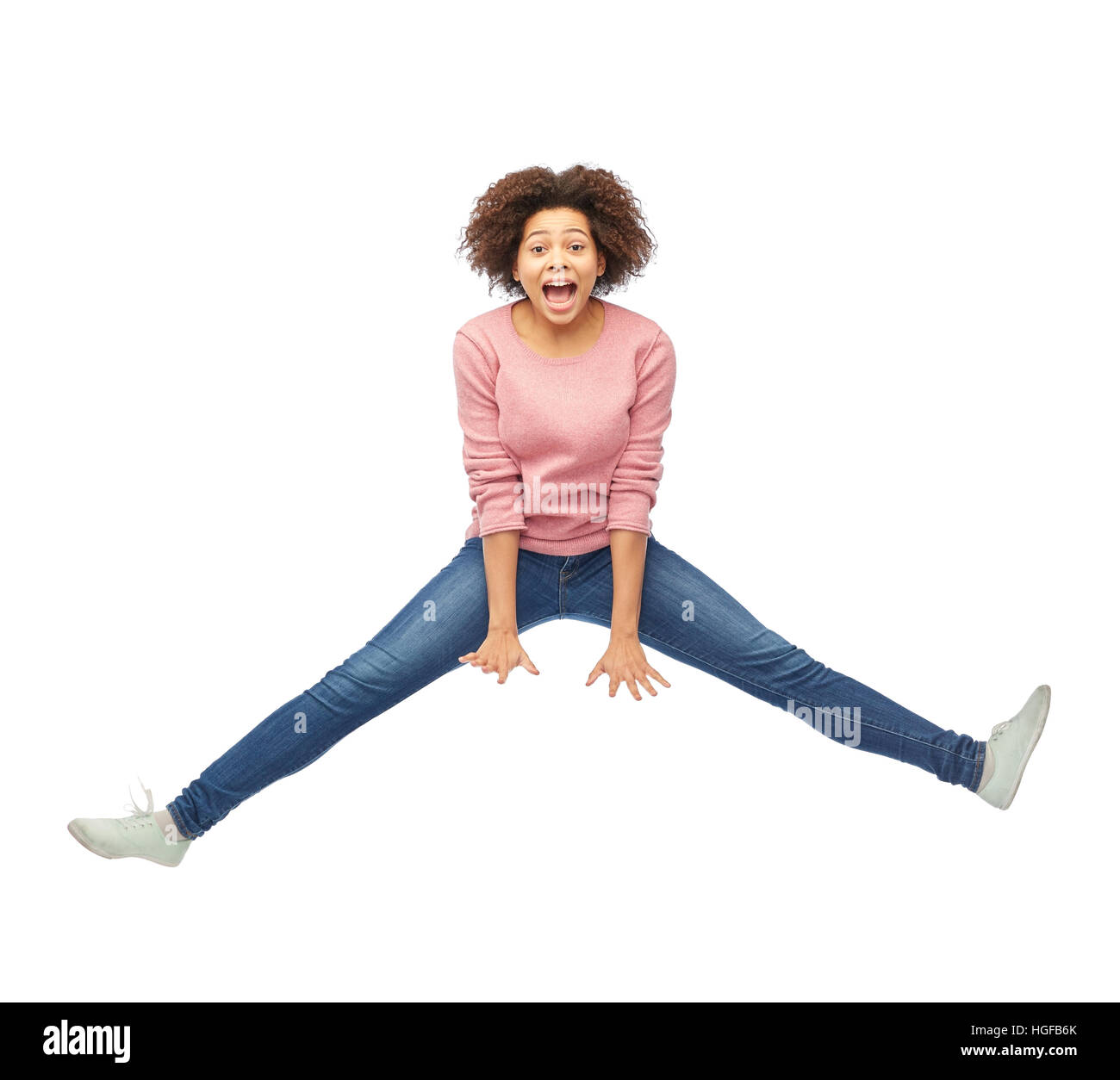 happy african american woman jumping over white Stock Photo - Alamy