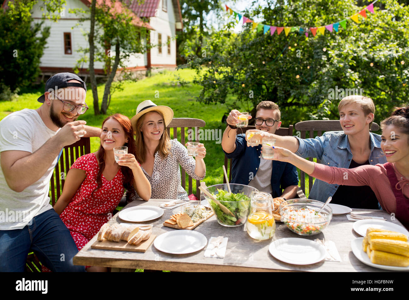 happy friends having party at summer garden Stock Photo - Alamy