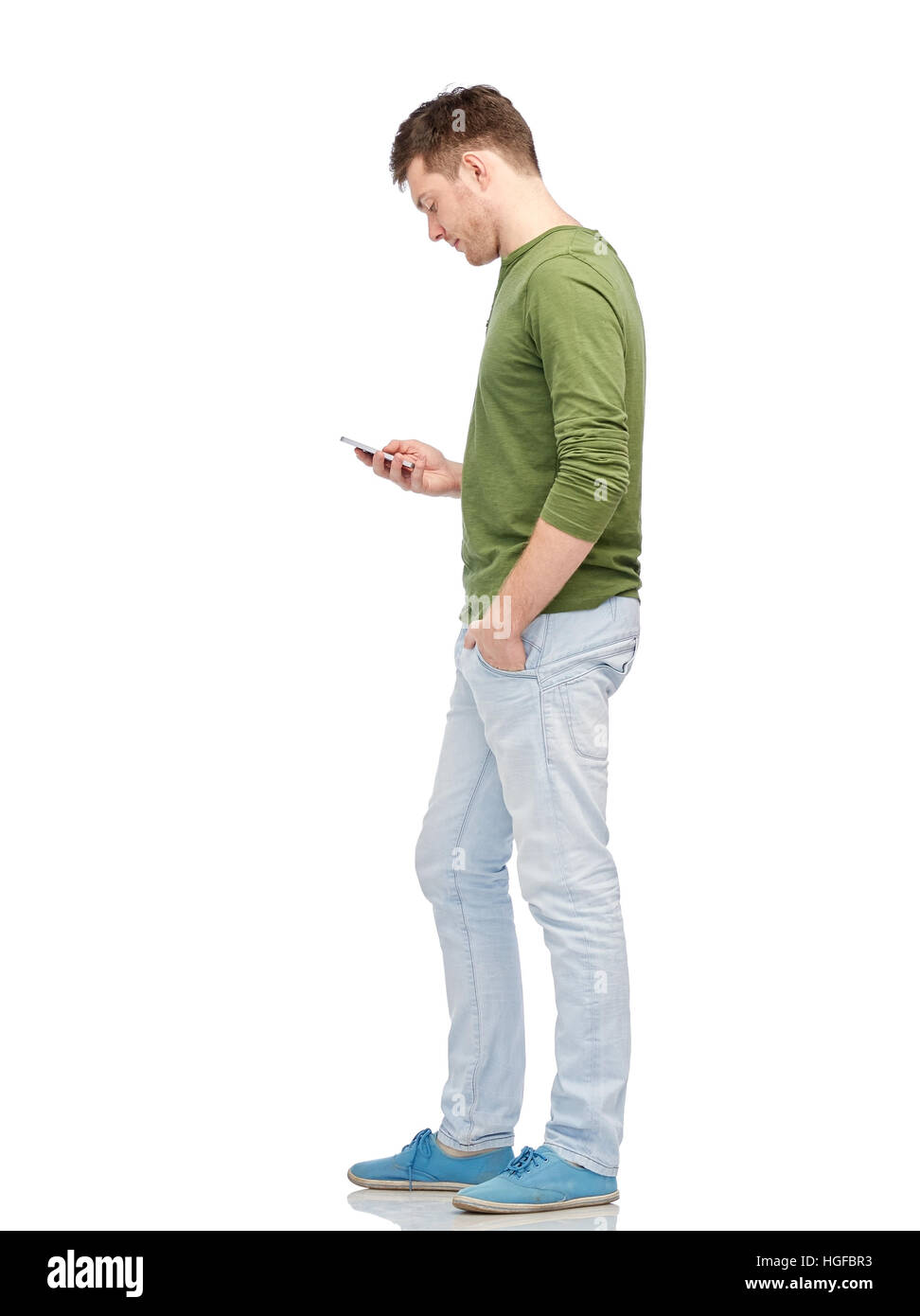 Young man texting smartphone hi-res stock photography and images - Alamy