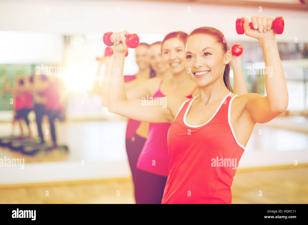 group of people working out with dumbbells Stock Photo - Alamy