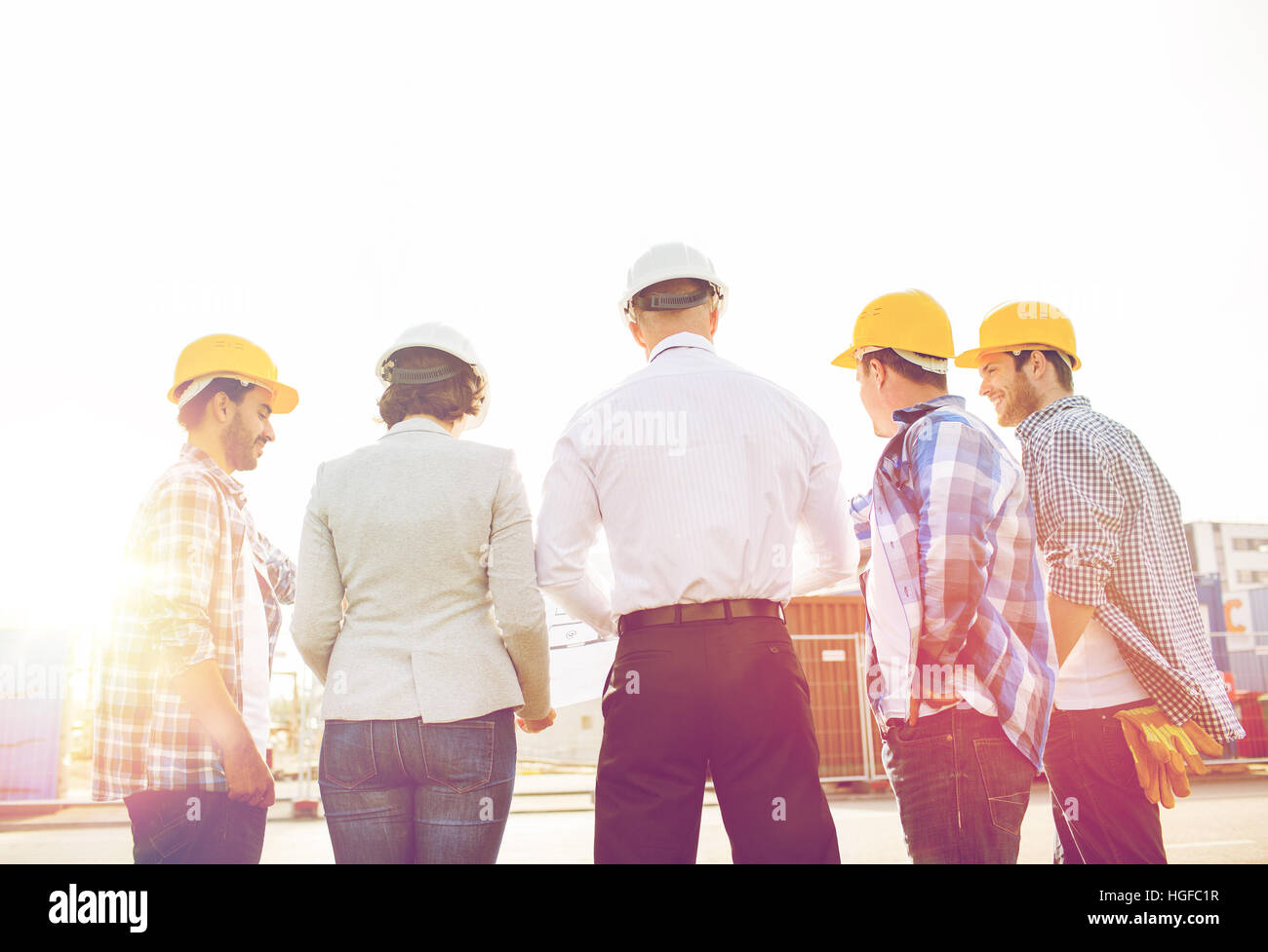 group of builders and architects at building site Stock Photo - Alamy