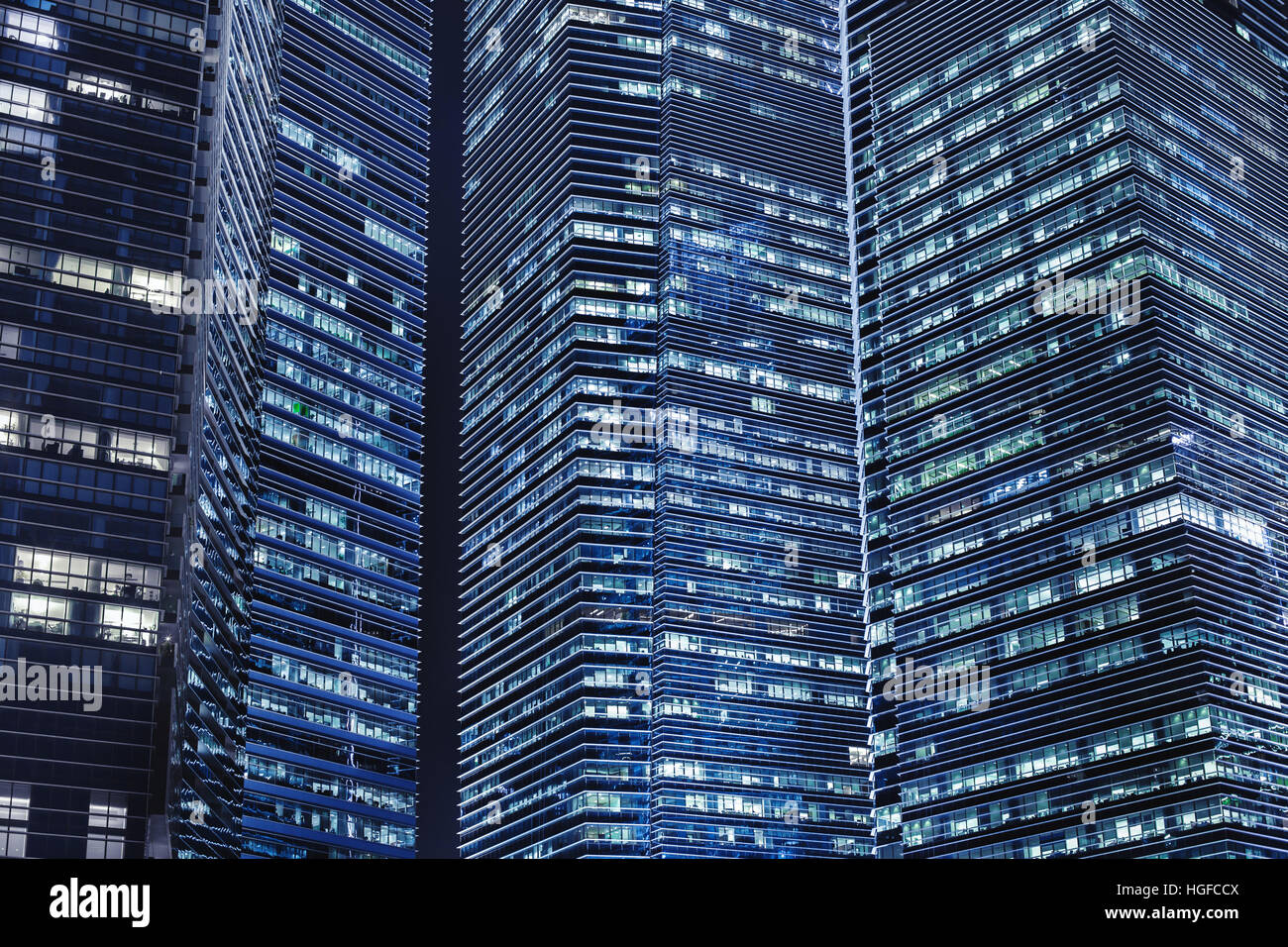 office buildings by night, background with illuminated modern ...