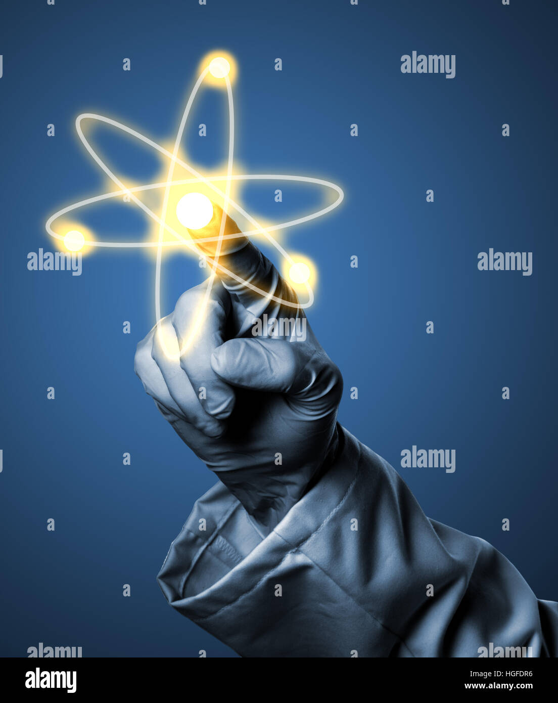 Researcher or scientist with rubber glove holding glowing atom model on ...