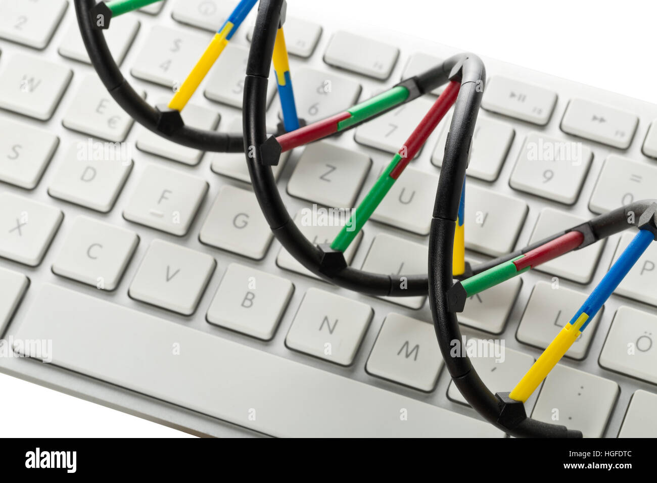 DNA molecule model on computer keyboard. Artificial intelligence ...