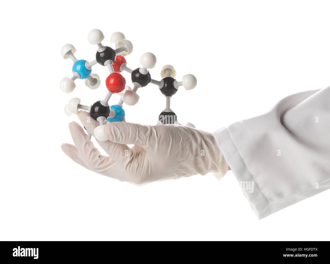 Researcher with glove holding chemical ball and stick molecule model ...