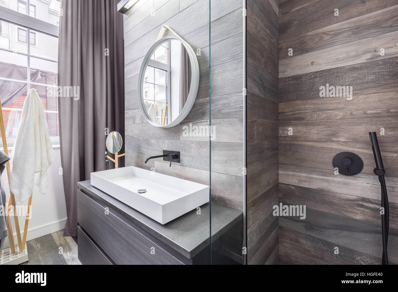Bathroom with walk in shower and white countertop basin Stock Photo - Alamy