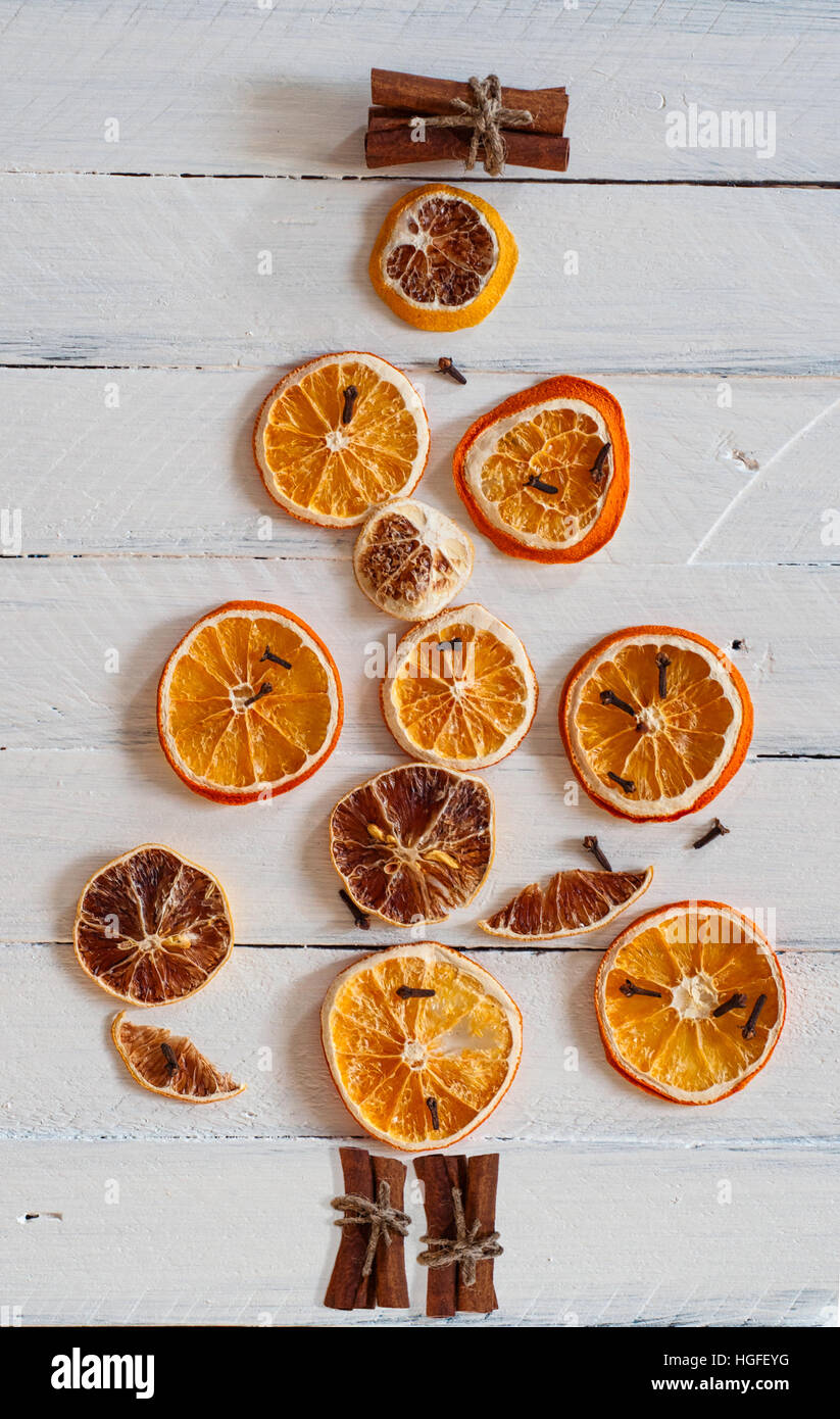 Figure Christmas tree of dried citrus fruit slices and cinnamon sticks ...