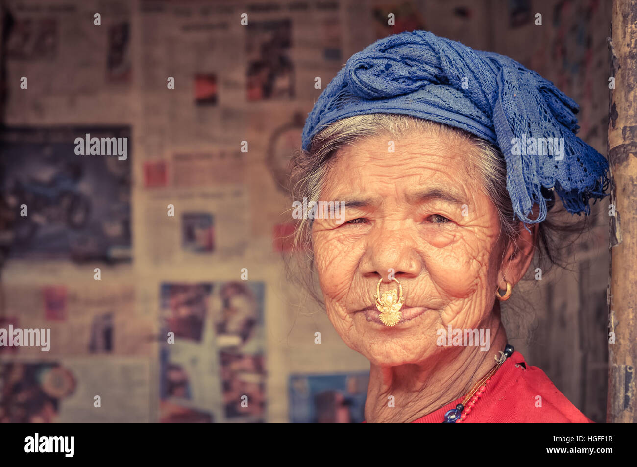 Damak, Nepal - circa May 2012: Old native woman with large piercing in ...