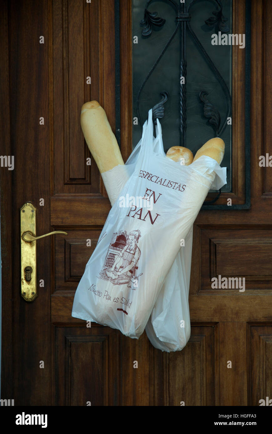 Loaves of bread hanging on a door in Asturias, Spain Stock Photo - Alamy