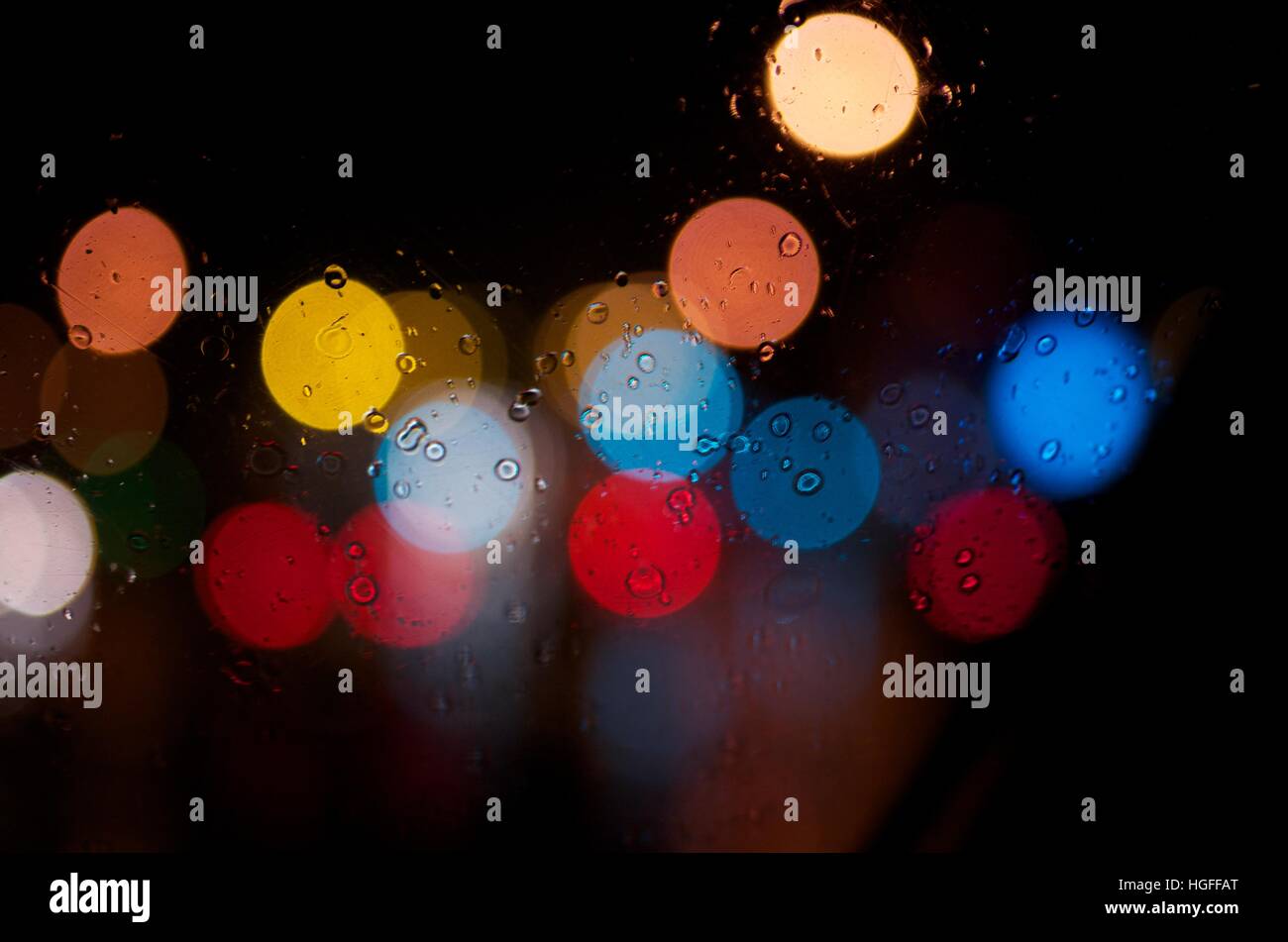 Colourful bokeh balls through wet glass Stock Photo - Alamy