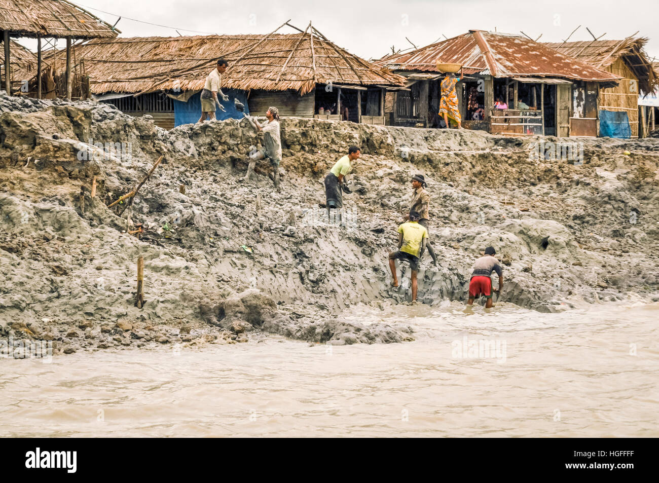 Sunderban, Bangladesh - circa July 2012: Six native men stand in mud ...